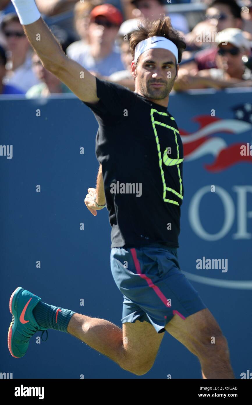 Roger Federer of Switzerland hits a ball during a practice session ...