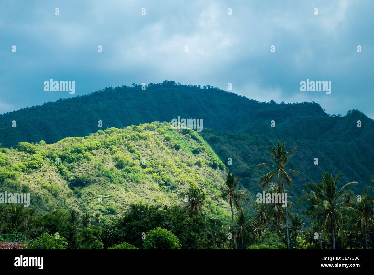 Bali tropical green hills and rain clouds Stock Photo - Alamy