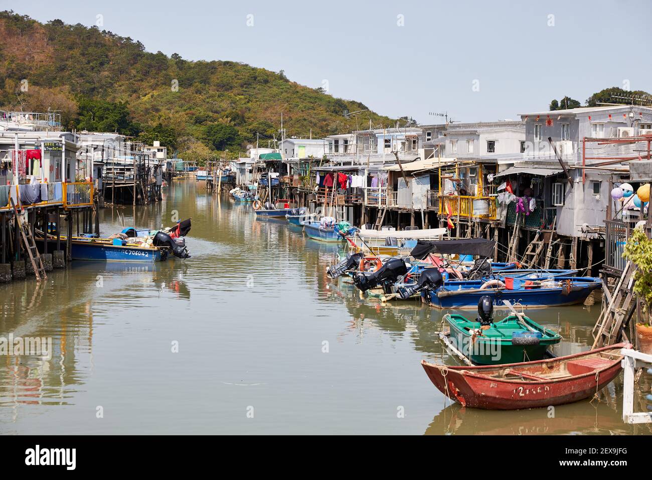 Boats and traditional stilt houses along the Tai O River in Tai O ...