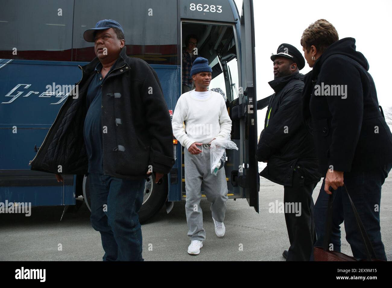 James Knight, 47, center, exits a Chicago-bound Greyhound bus during a ...