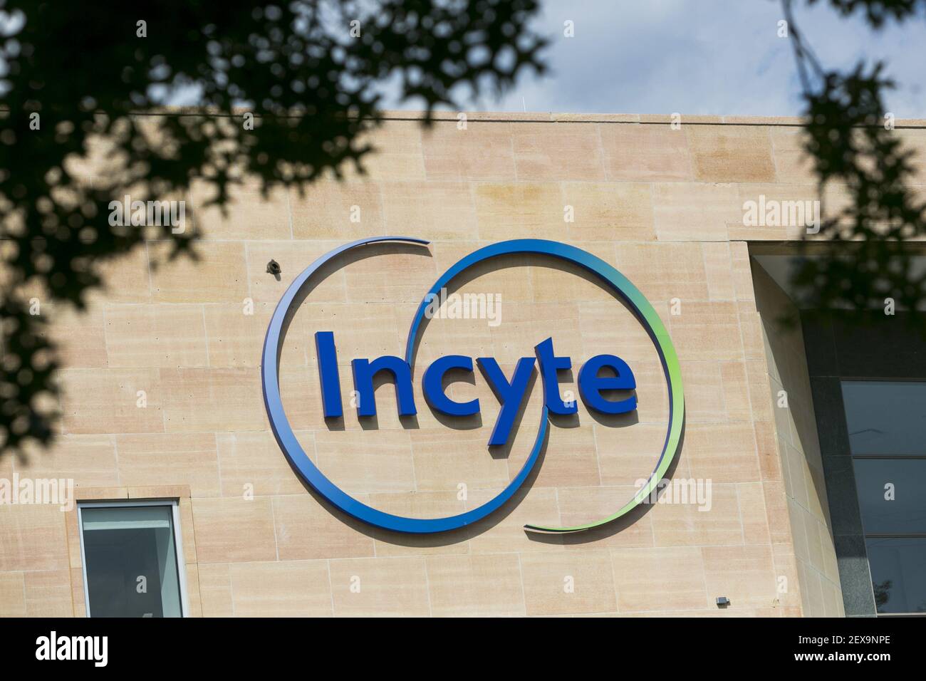 A logo sign outside of the headquarters of the Incyte Corporation in ...