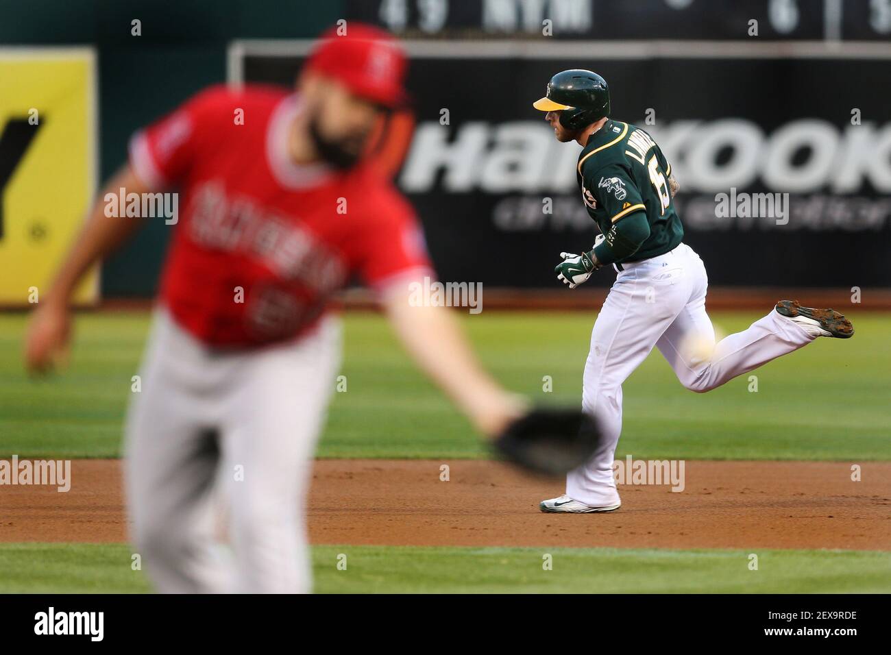 The Oakland Athletics' Brett Lawrie, right, circles the bases on a home ...