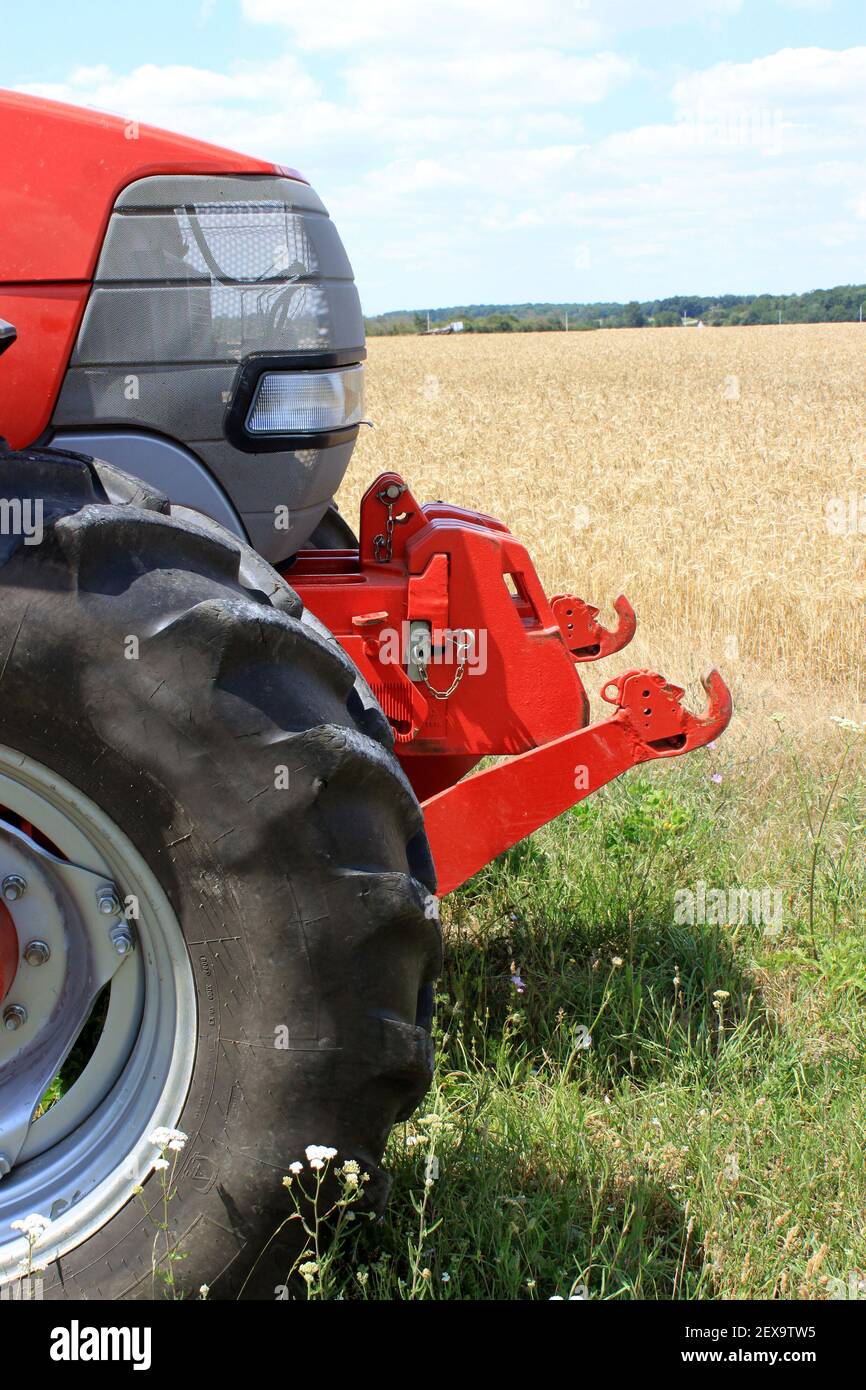 In front of a tractor Stock Photo - Alamy