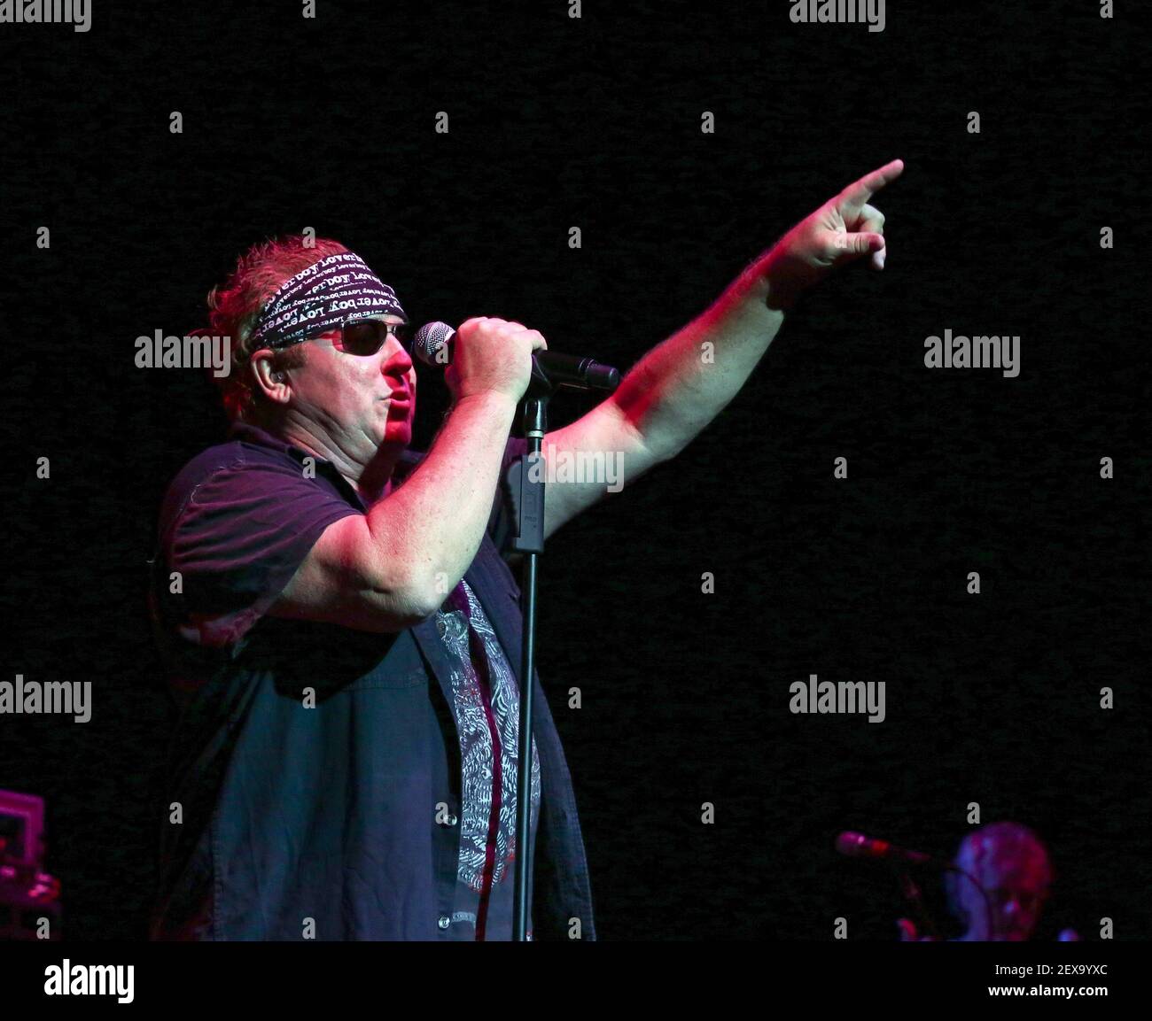 FL: Loverboy Mike Reno performs during the opening act for Rick ...