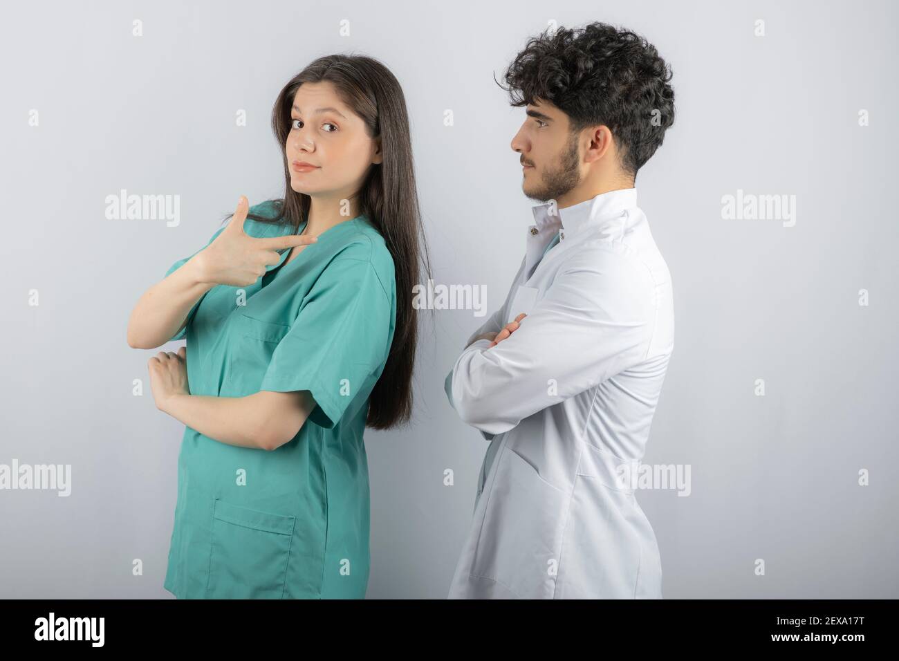 Young nurse pointing finger to the doctor Stock Photo - Alamy Young nurse pointing finger to the doctor Stock Photo - Alamy