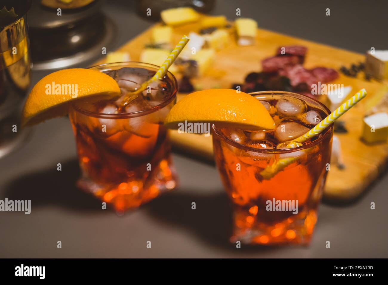 Mixing tasty and trendy alcoholic coctails at home Stock Photo - Alamy