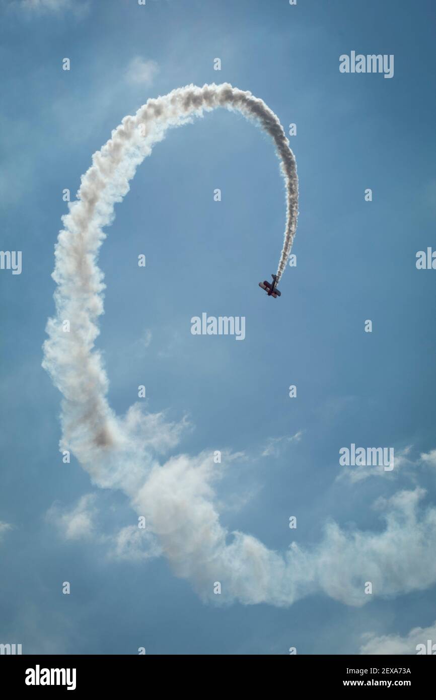 Plane doing a looping stunt at an airshow Stock Photo - Alamy