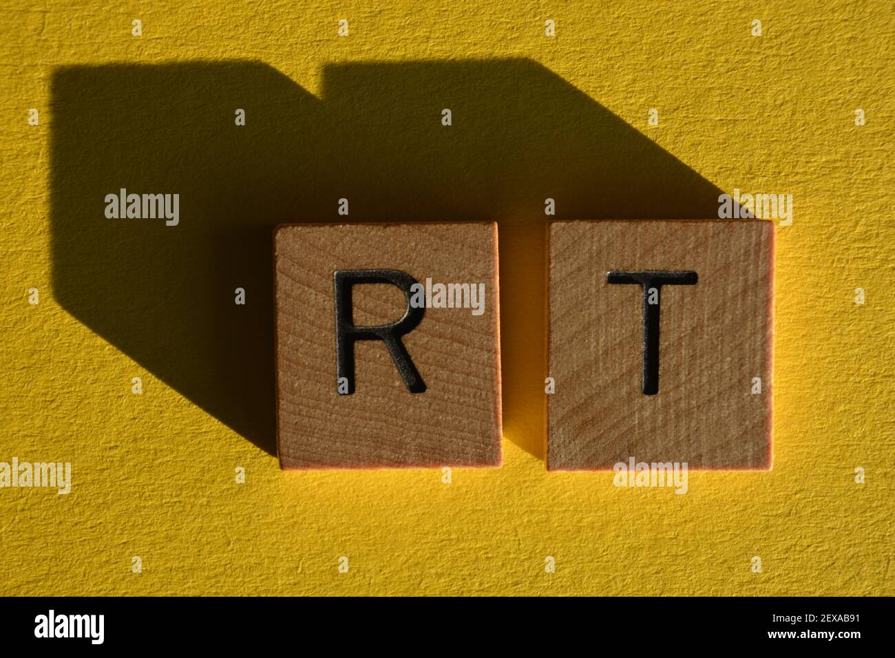 RT, acronym for Retweet or Real Talk in wooden alphabet letters ...
