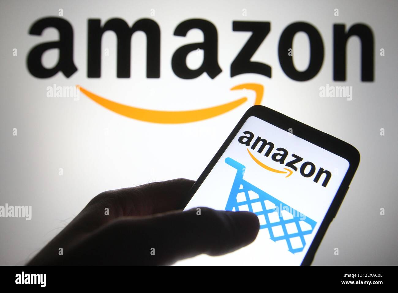 In this photo illustration the Amazon logo is seen on a smartphone and ...