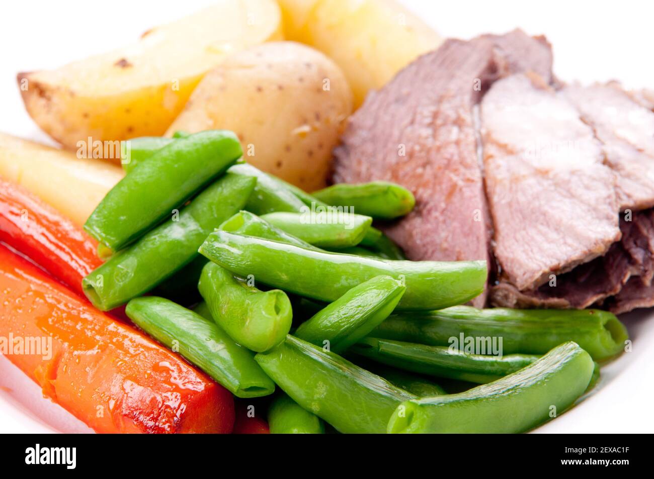 sliced leg of lamb with fresh vegetables Stock Photo - Alamy