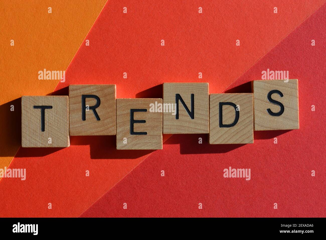 Trends, word in wooden alphabet letters isolated on colourful ...