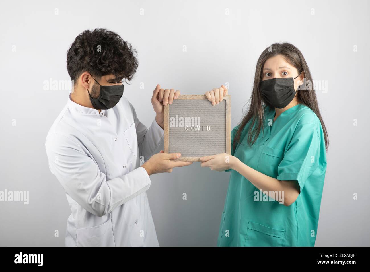 Couple is arguing about possession of modern computer Stock Photo - Alamy