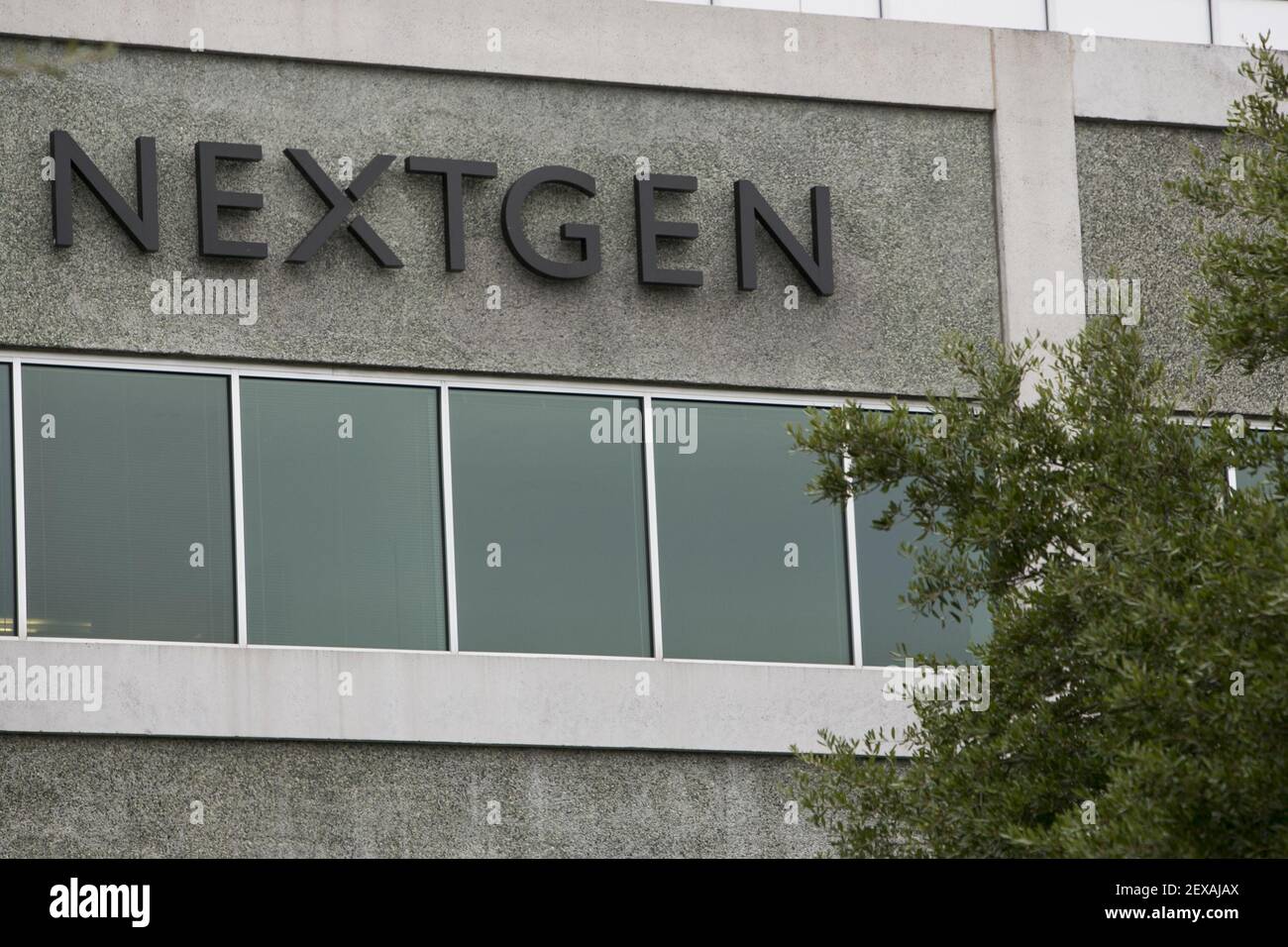A logo sign outside of a facility occupied by NextGen Healthcare in ...