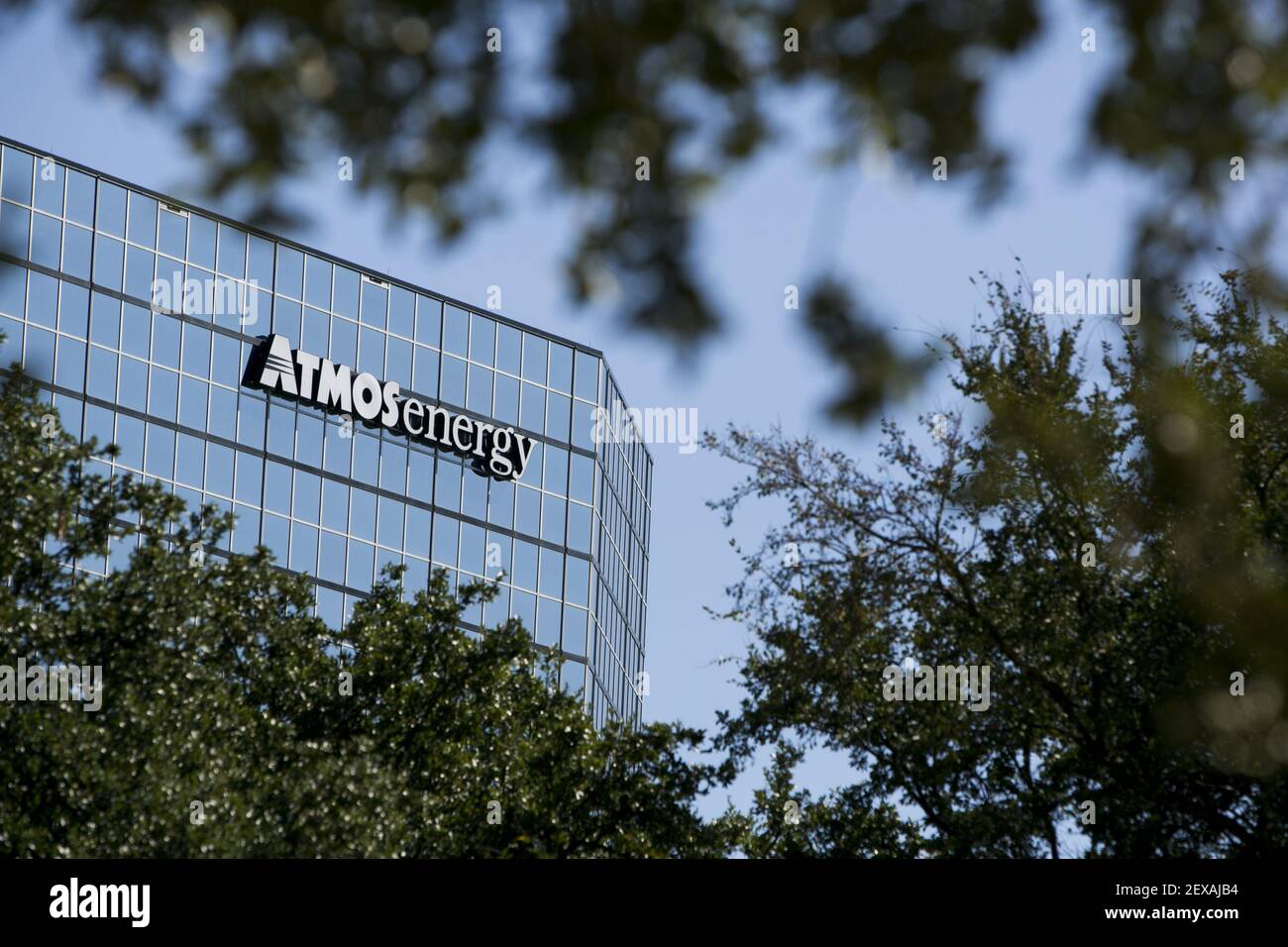 A logo sign outside of the headquarters of The Atmos Energy Corporation ...
