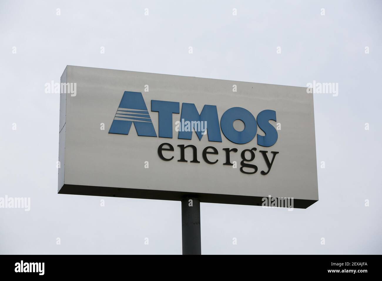 A logo sign outside of a facility occupied by Atmos Energy in Round ...