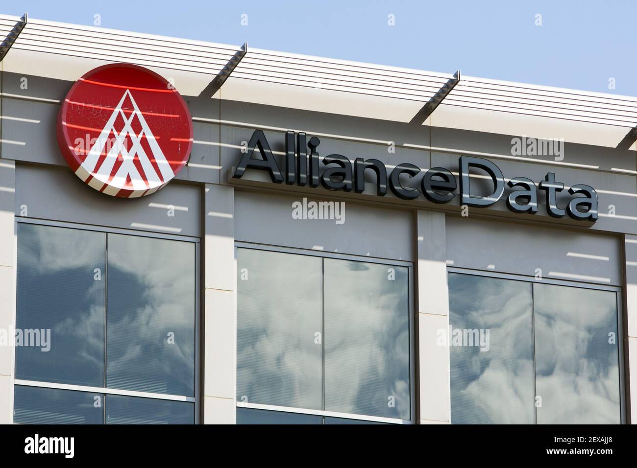 A logo sign outside of the headquarters of the Alliance Data Systems ...
