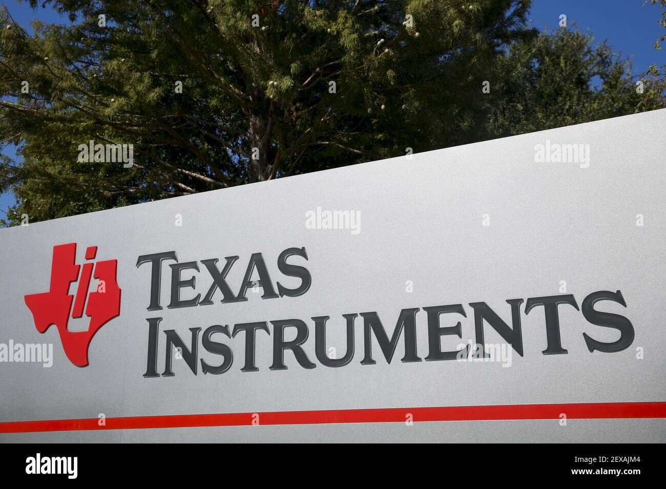A logo sign outside of the headquarters of Texas Instruments in Dallas ...