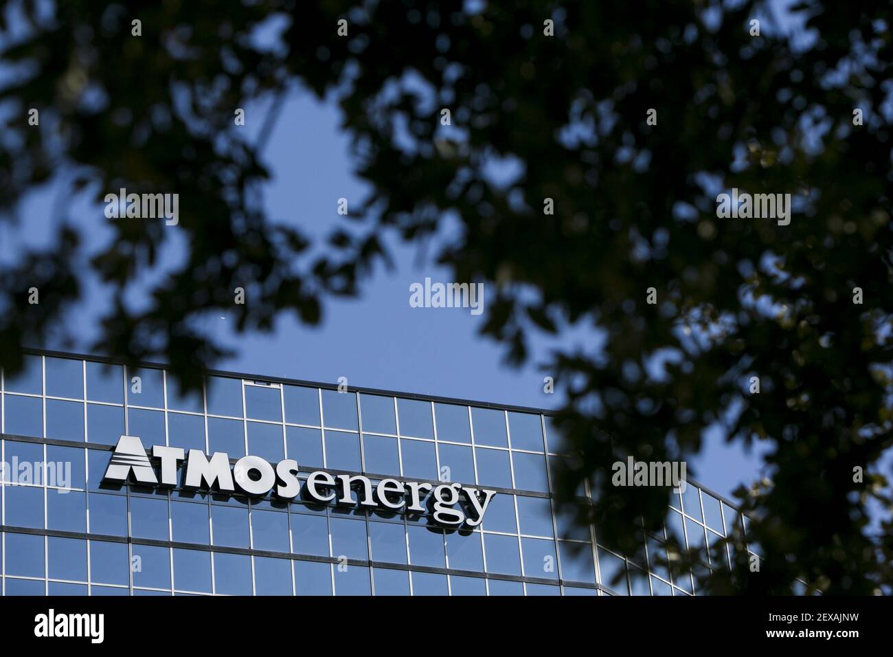 A logo sign outside of the headquarters of The Atmos Energy Corporation ...