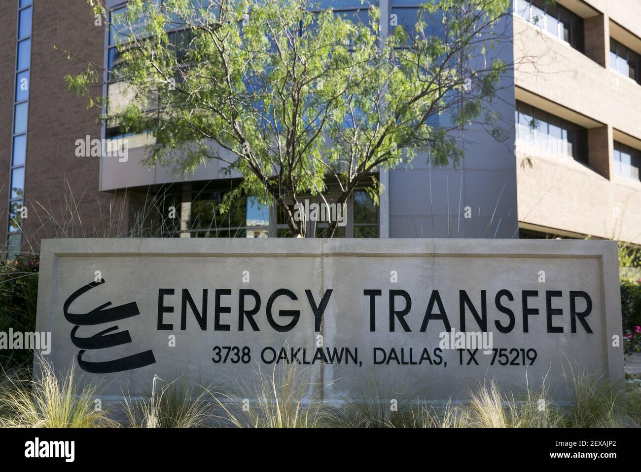A logo sign outside of the headquarters of Energy Transfer Equity in ...