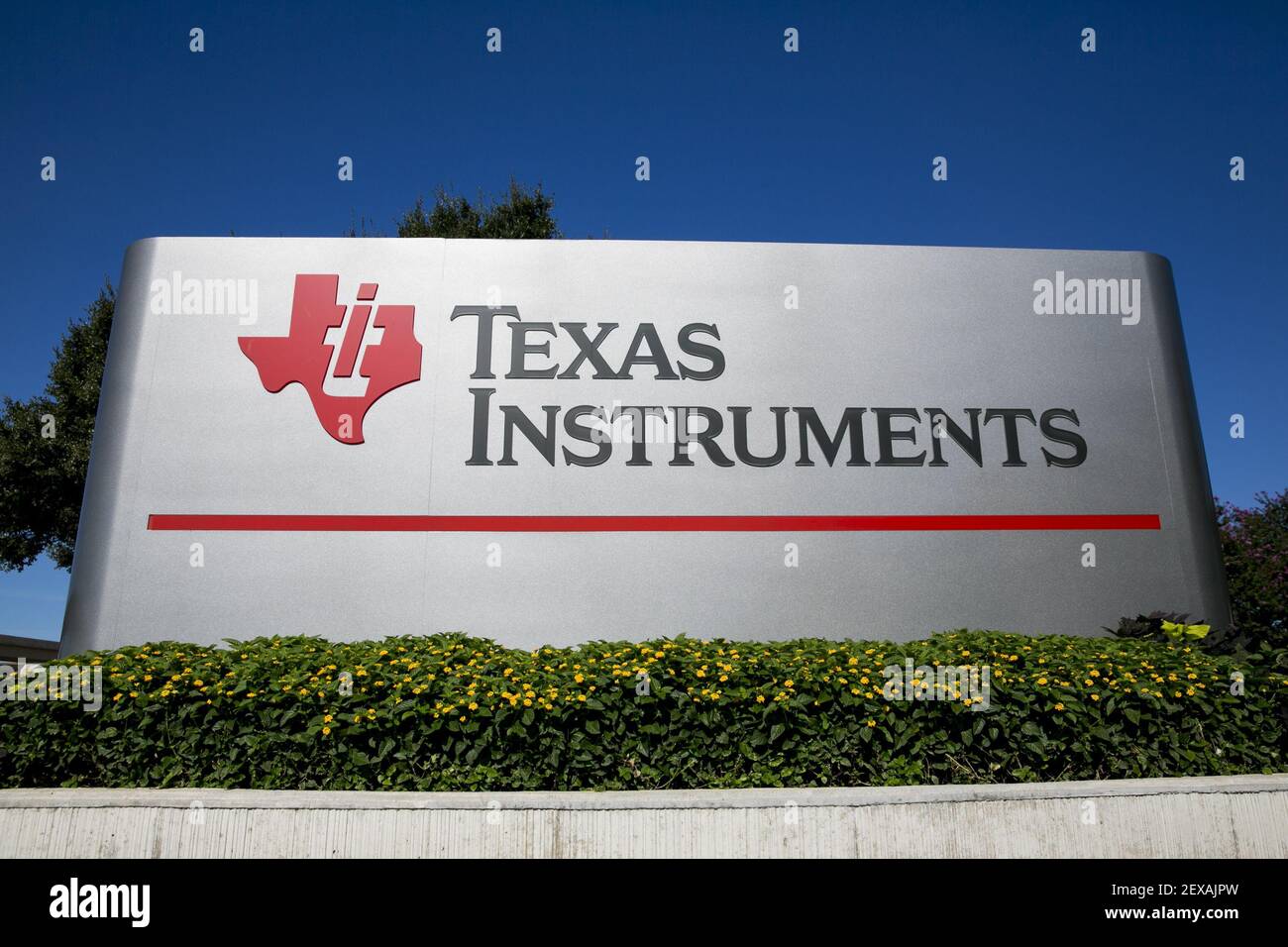 A logo sign outside of the headquarters of Texas Instruments in Dallas ...