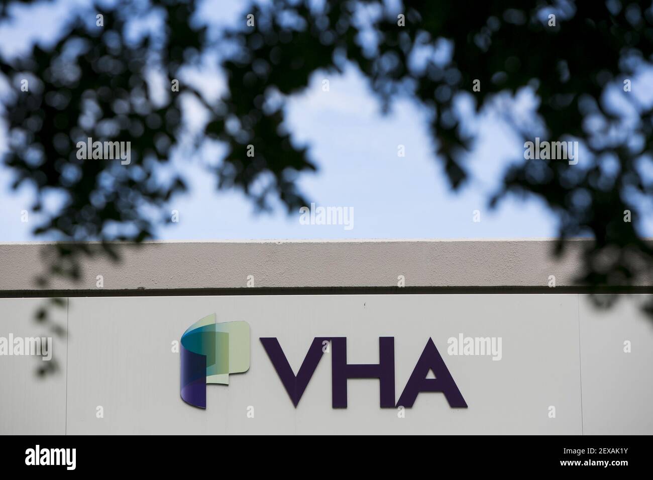 A logo sign outside of the headquarters of VHA, Inc., the parent ...