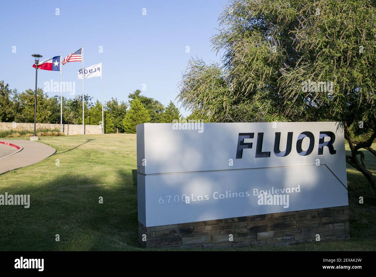 A logo sign outside of the headquarters of the Fluor Corporation in ...