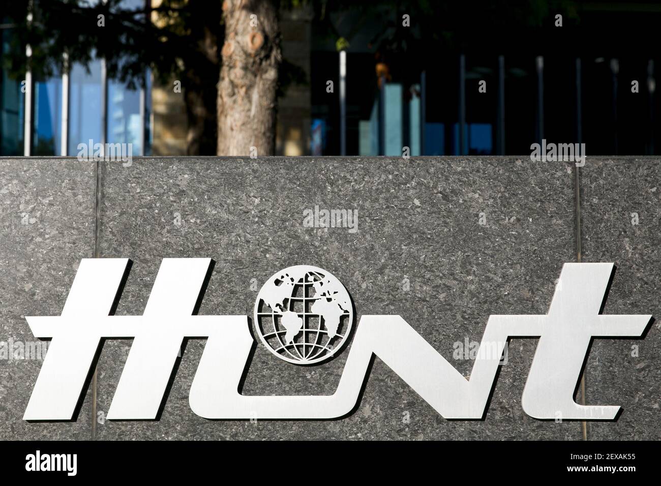 A logo sign outside of the headquarters of the Hunt Oil Company in ...
