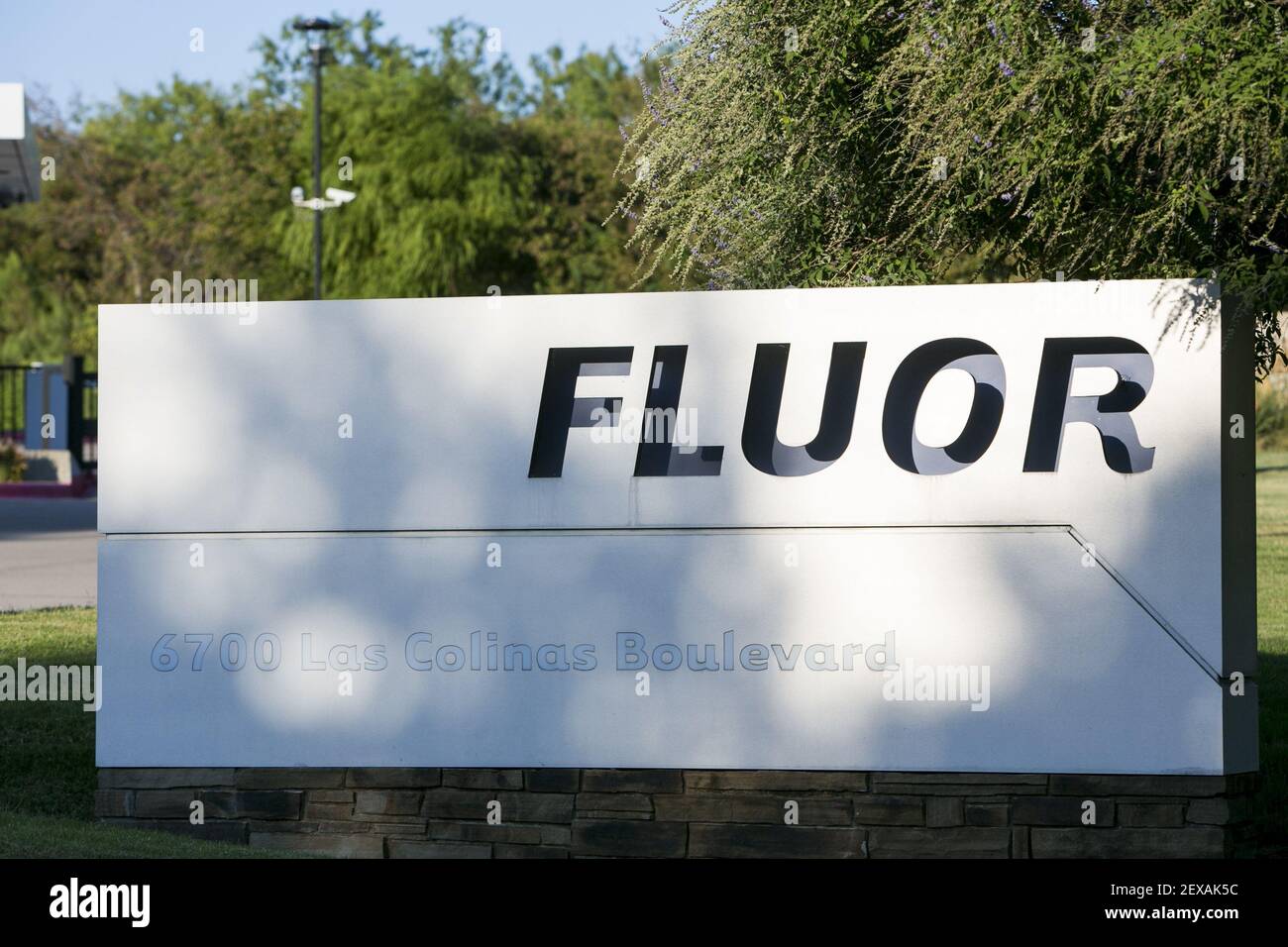 A logo sign outside of the headquarters of the Fluor Corporation in ...