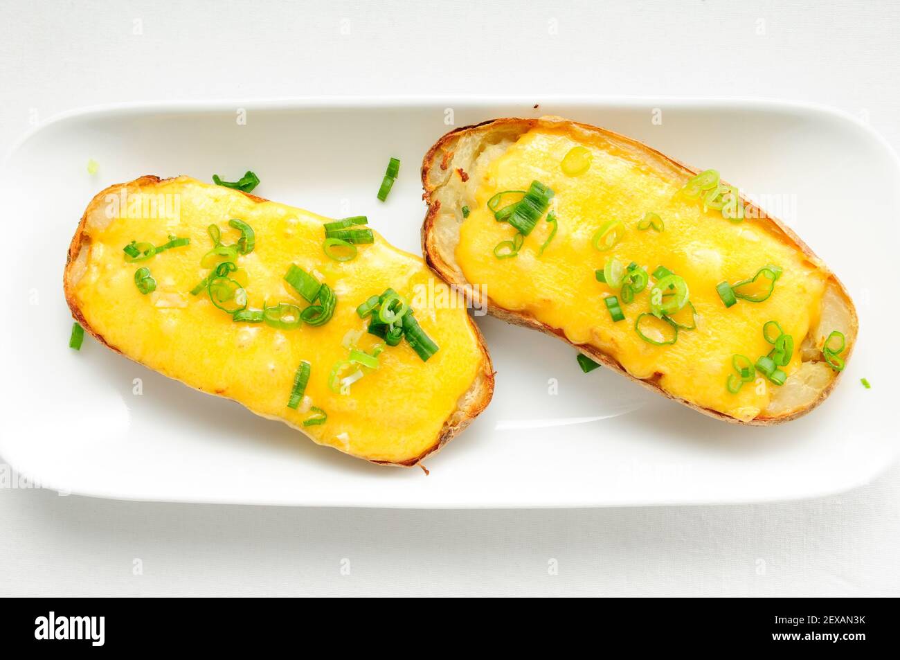 delicious twice baked potatoes smothered with aged cheddar cheese Stock ...