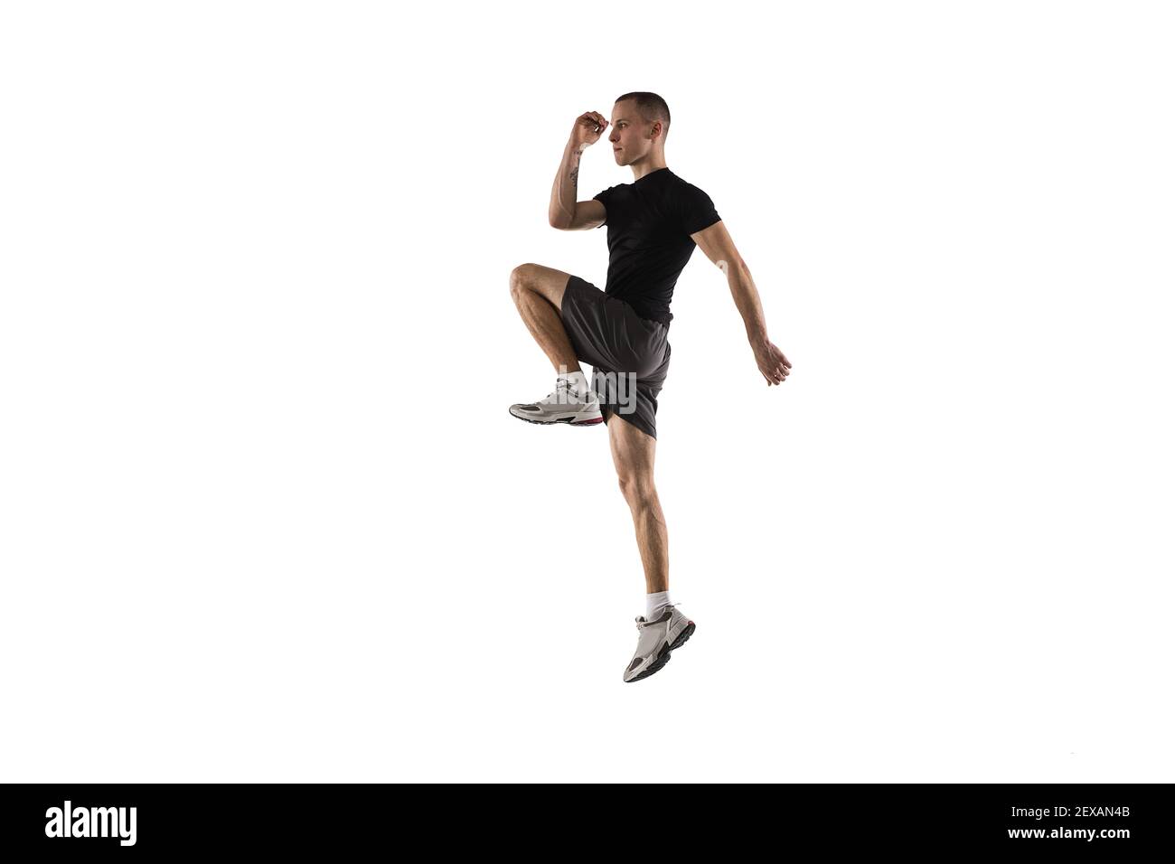 Running. Young caucasian male model in action, motion isolated on white ...