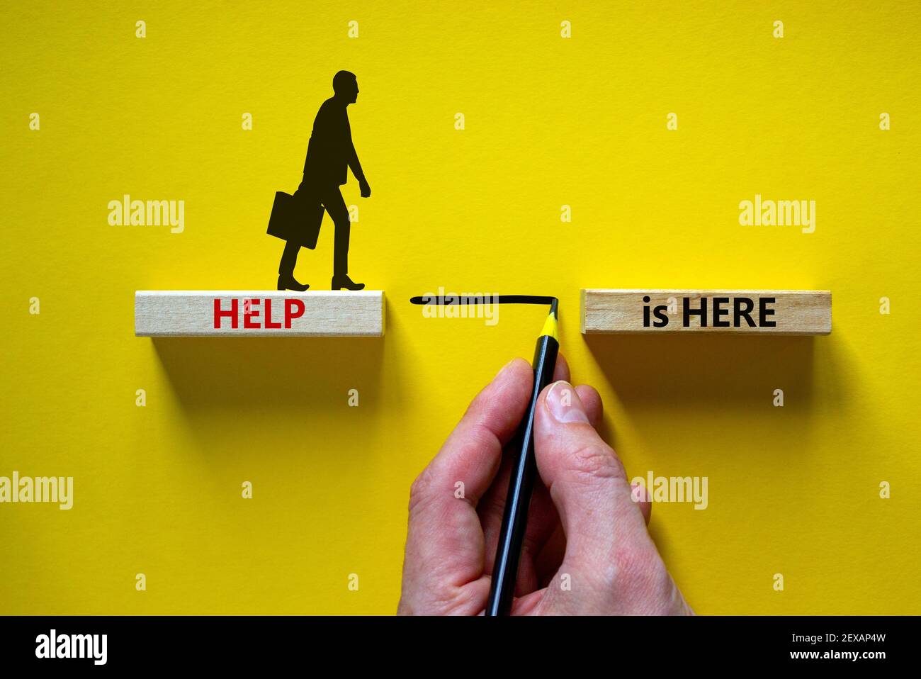 Help is here symbol. Wooden blocks with words 'Help is here' on ...