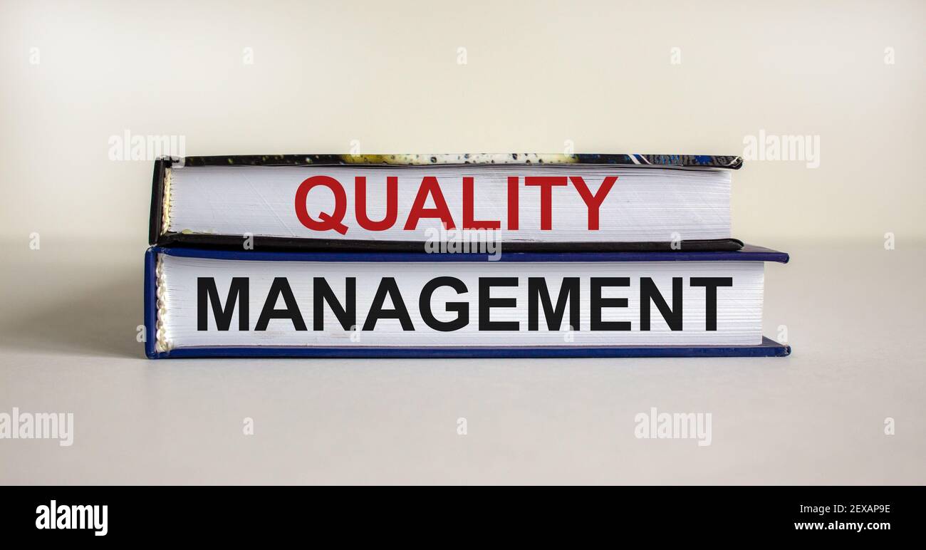 Quality management symbol. Concept words 'Quality management' on books ...
