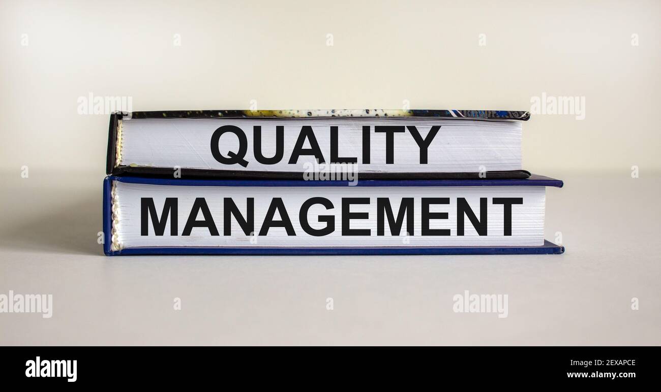 Quality management symbol. Concept words 'Quality management' on books ...