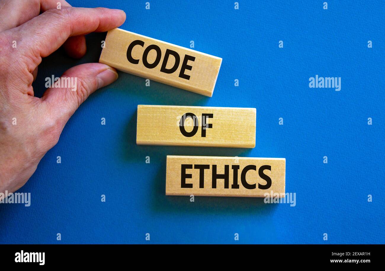 Code of ethics symbol. Concept words 'Code of ethics' on wooden blocks ...
