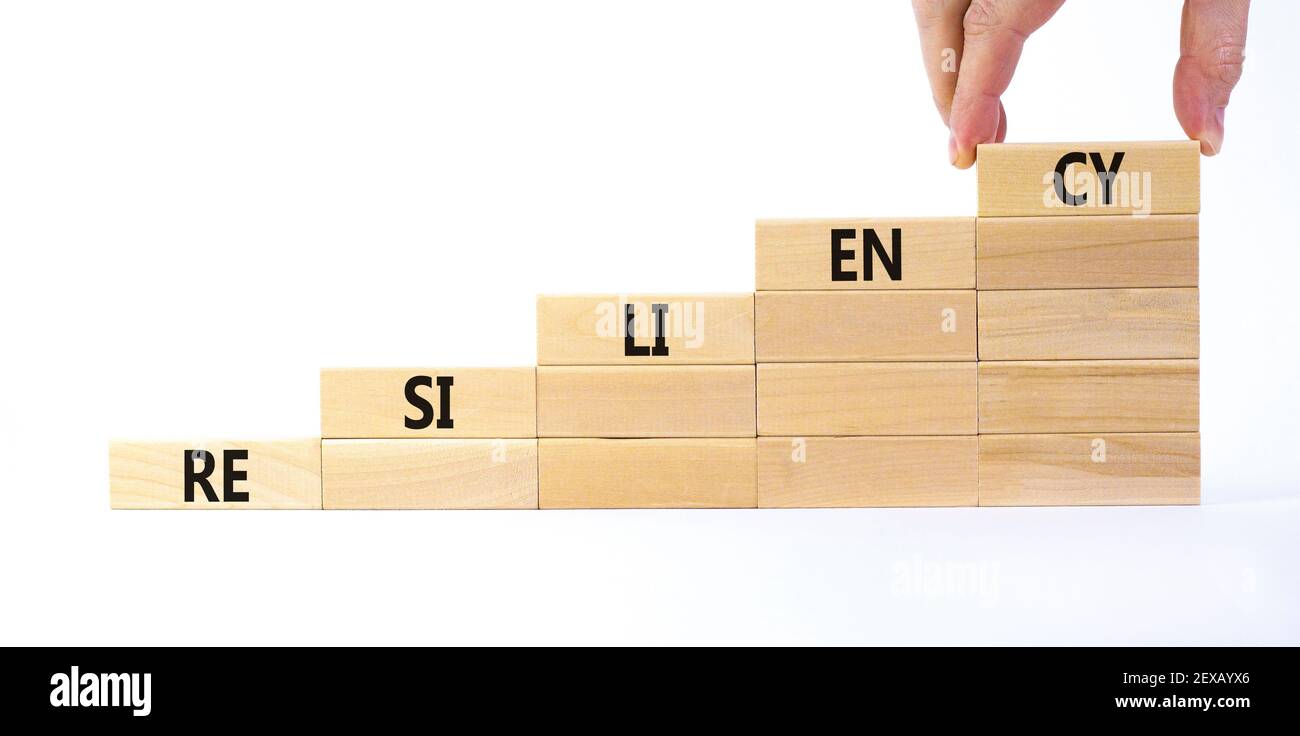 Resiliency symbol. Wooden blocks with word 'resiliency' stacking as ...