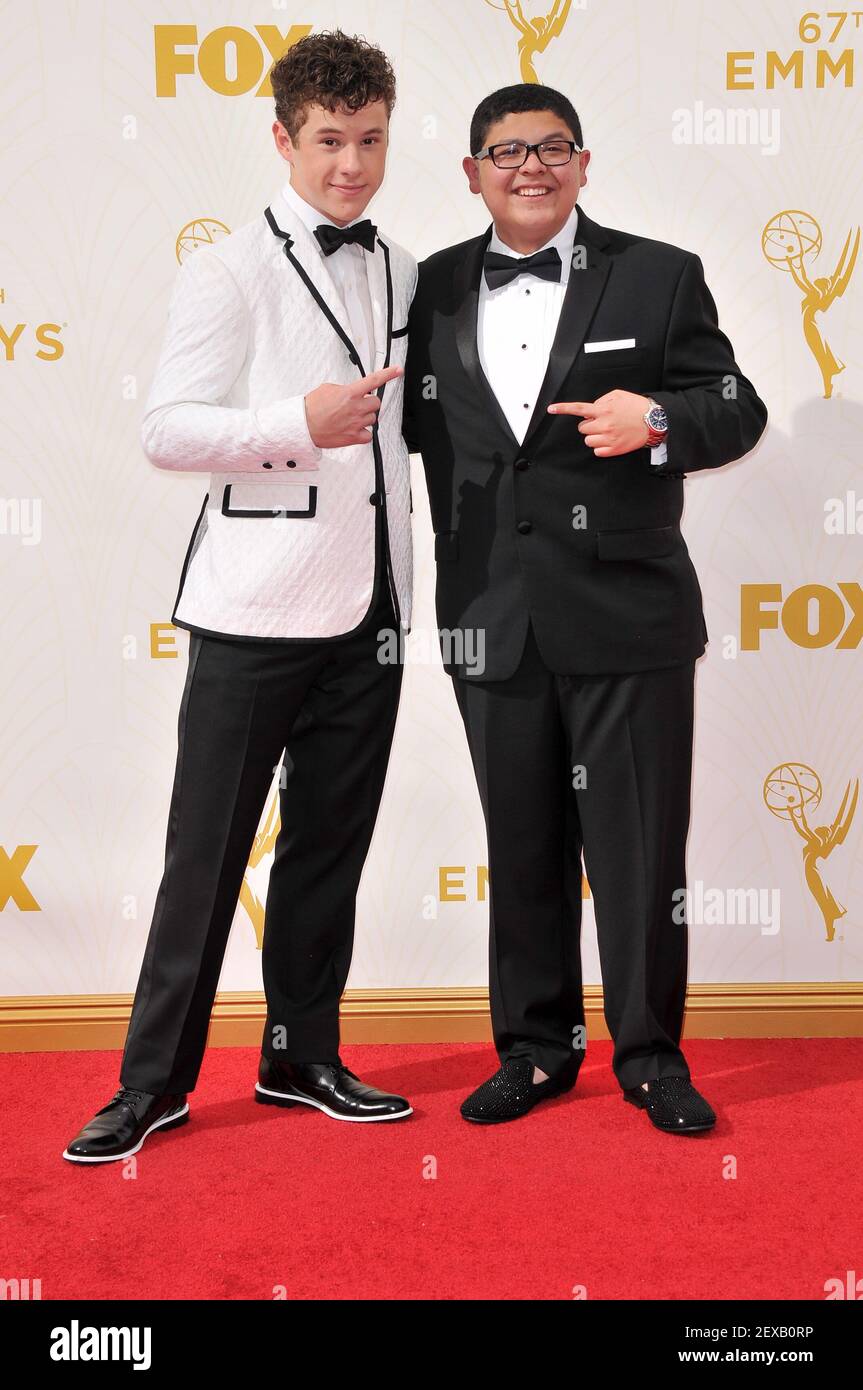 Nolan Gould and Rico Rodriguez arrives at the 67th Emmy Awards held at ...