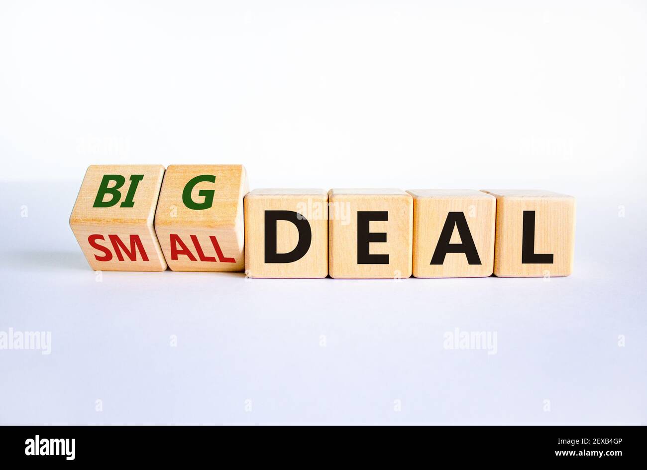 Big or small deal symbol. Turned wooden cubes and changed words 'small ...