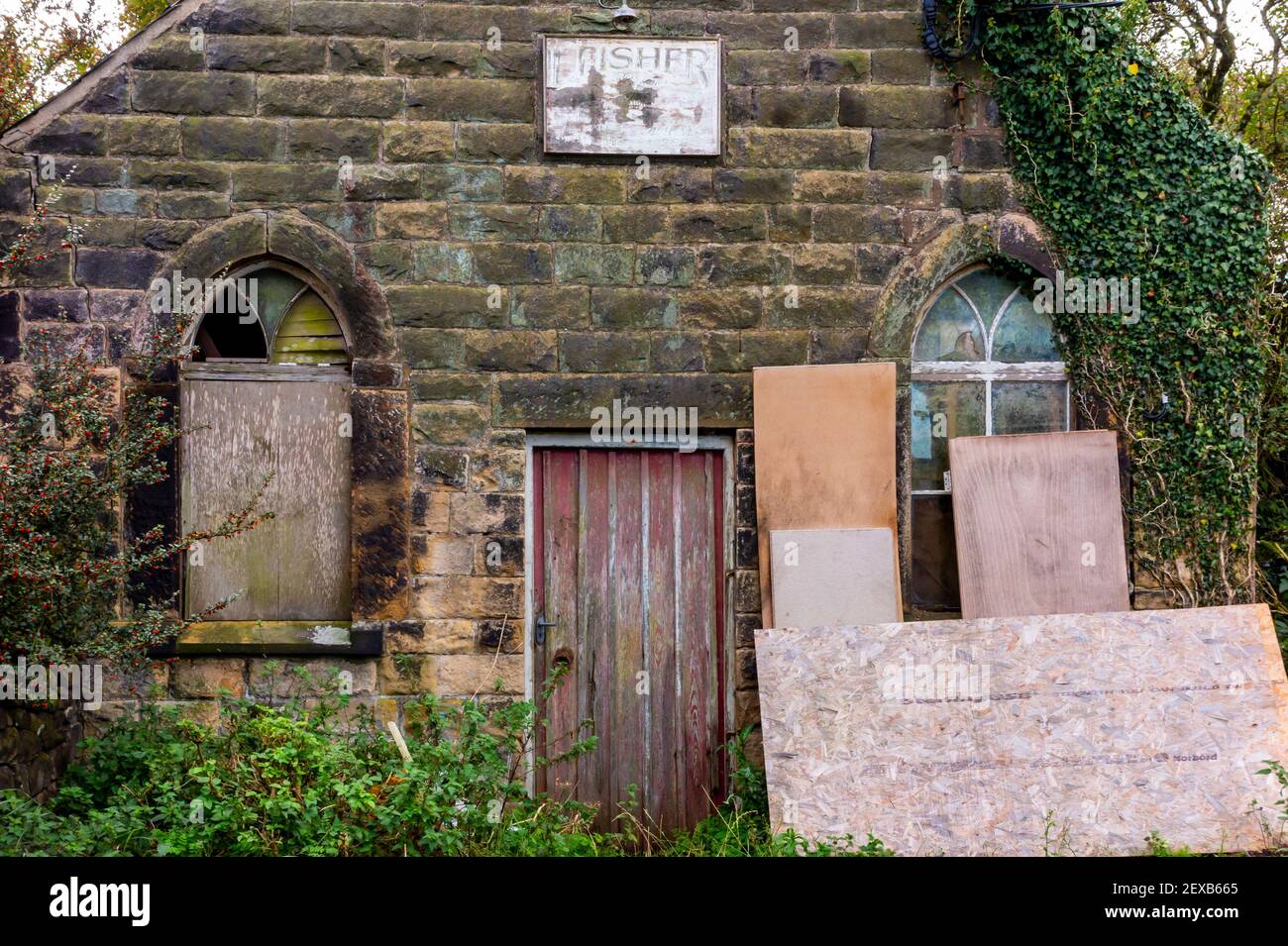 Boarded up derelict stone building used for storage in Alton Derbyshire ...