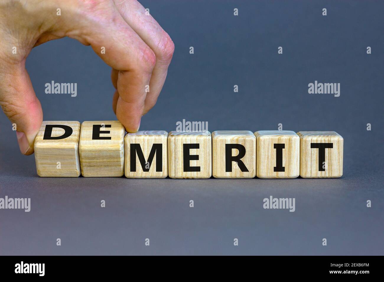 Demerit or merit symbol. Businessman turns wooden cubes and changes ...