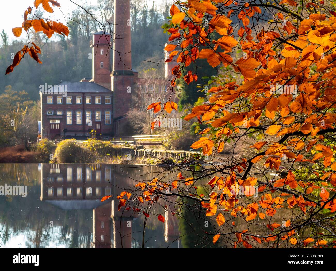 Autumn view of Masson Mill and River Derwent at Matlock Bath a hillside ...