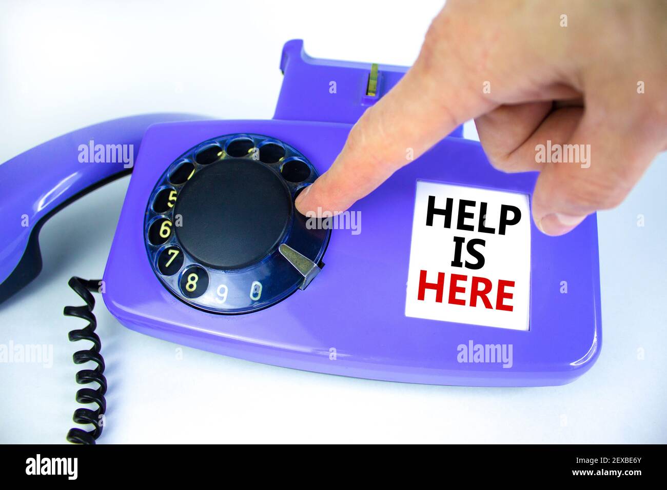 Help is here symbol. Old blue rotary dial telephone. Words 'Help is ...