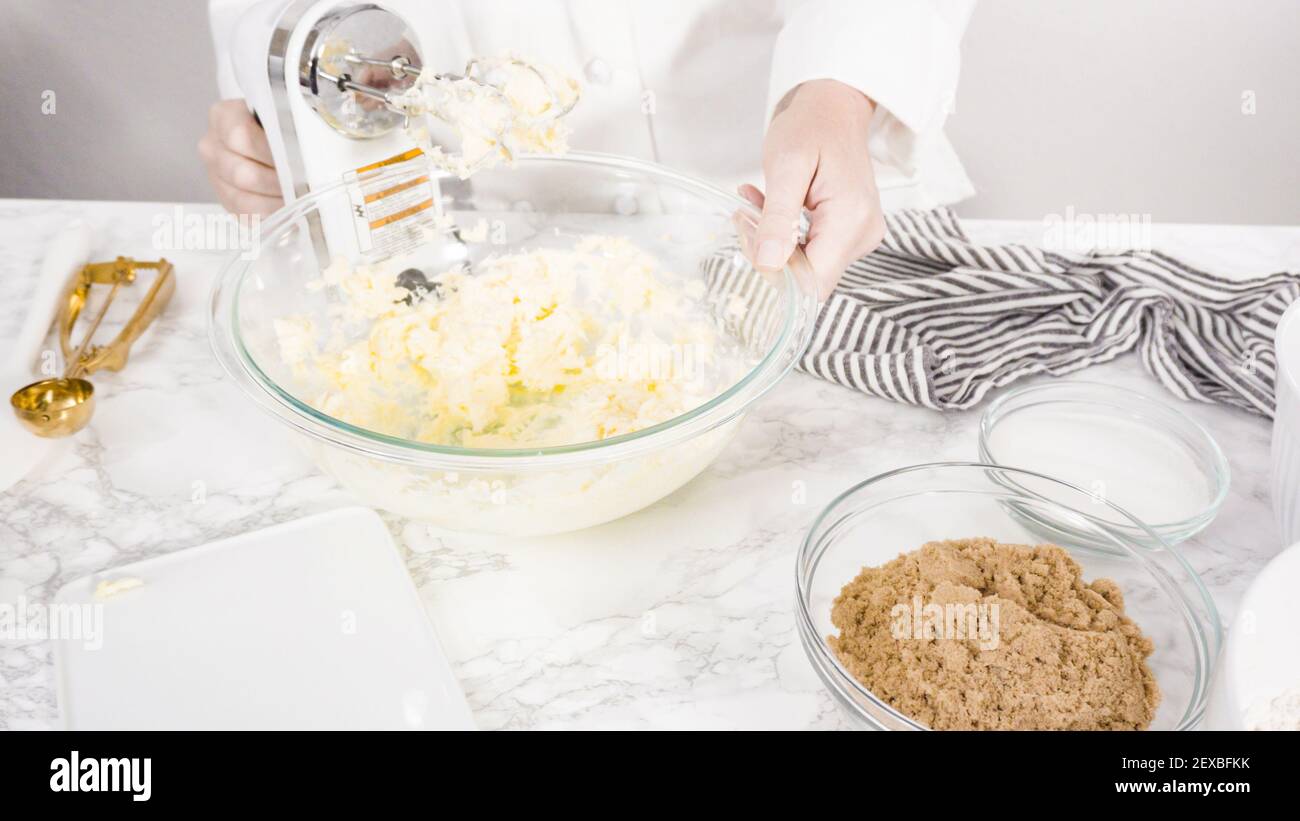 Step by step. Mixing ingredients in a glass bowl to make chocolate chip ...