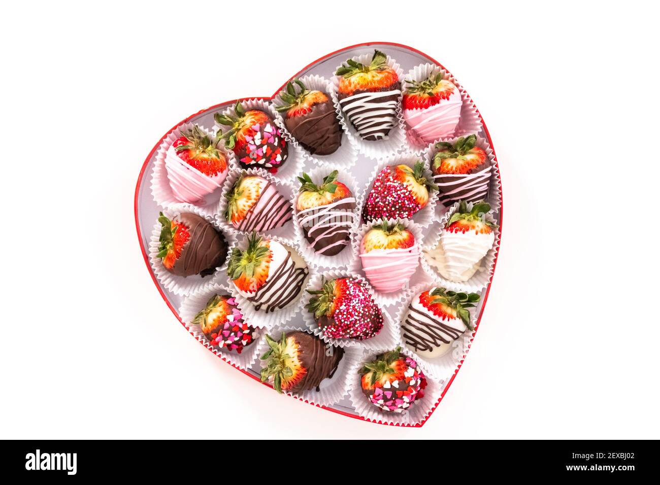 Flat lay. Variety of chocolate dipped strawberries in a heart-shaped ...