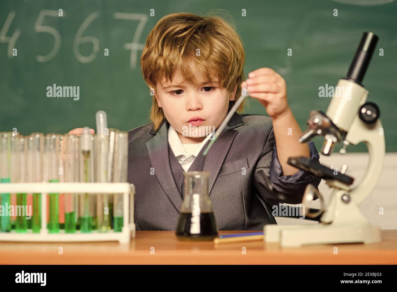 biology science. Little boy is making science experiments. little boy ...