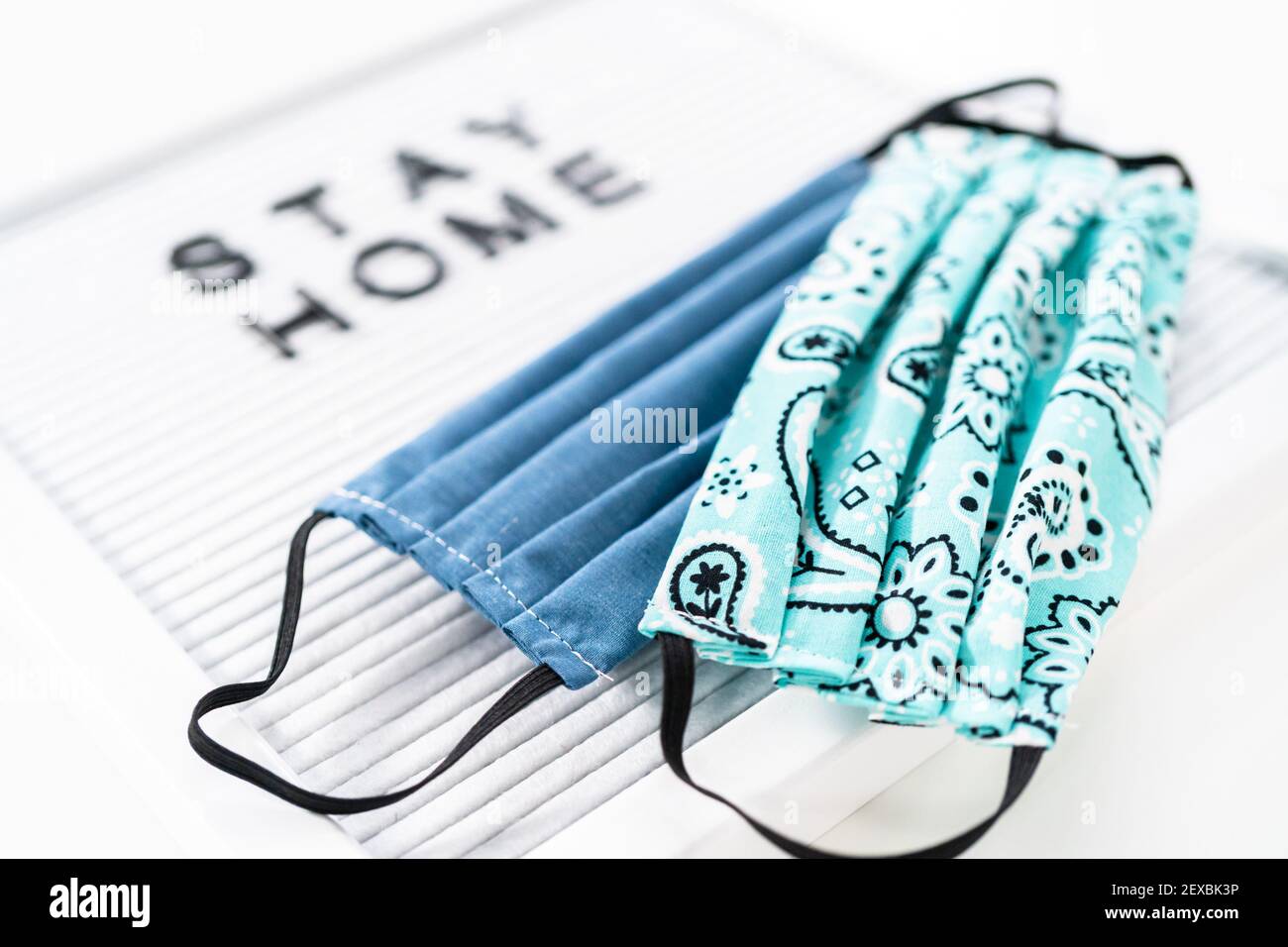 STAY HOME sign on message board with a homemade face mask Stock Photo ...