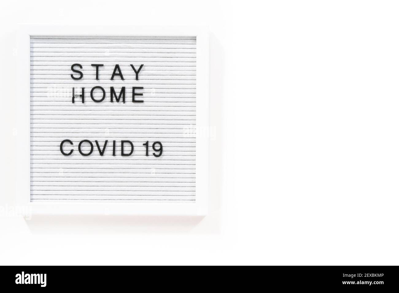 STAY HOME and COVID-19 sign on message board Stock Photo - Alamy