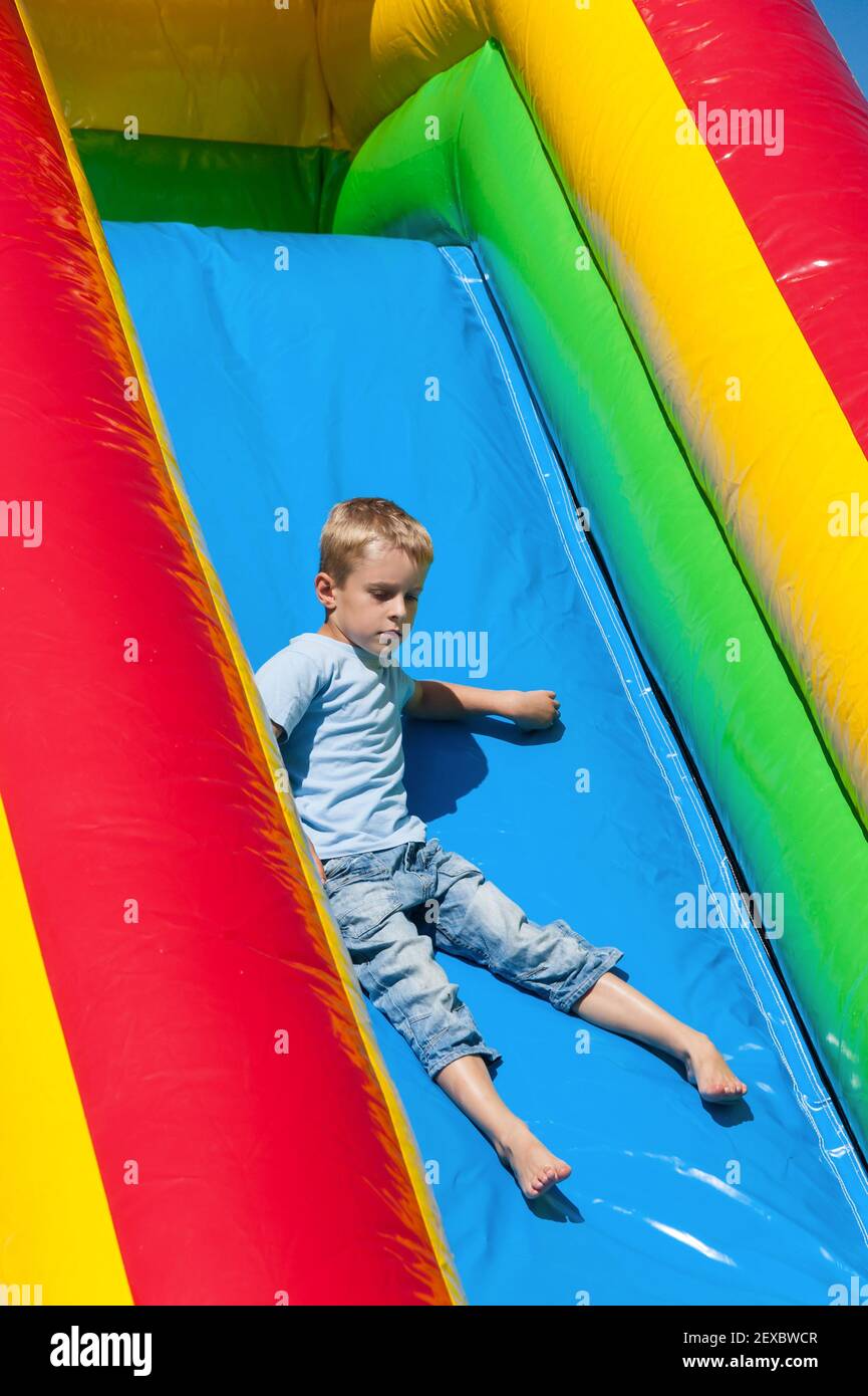 Little boy in slide Stock Photo - Alamy