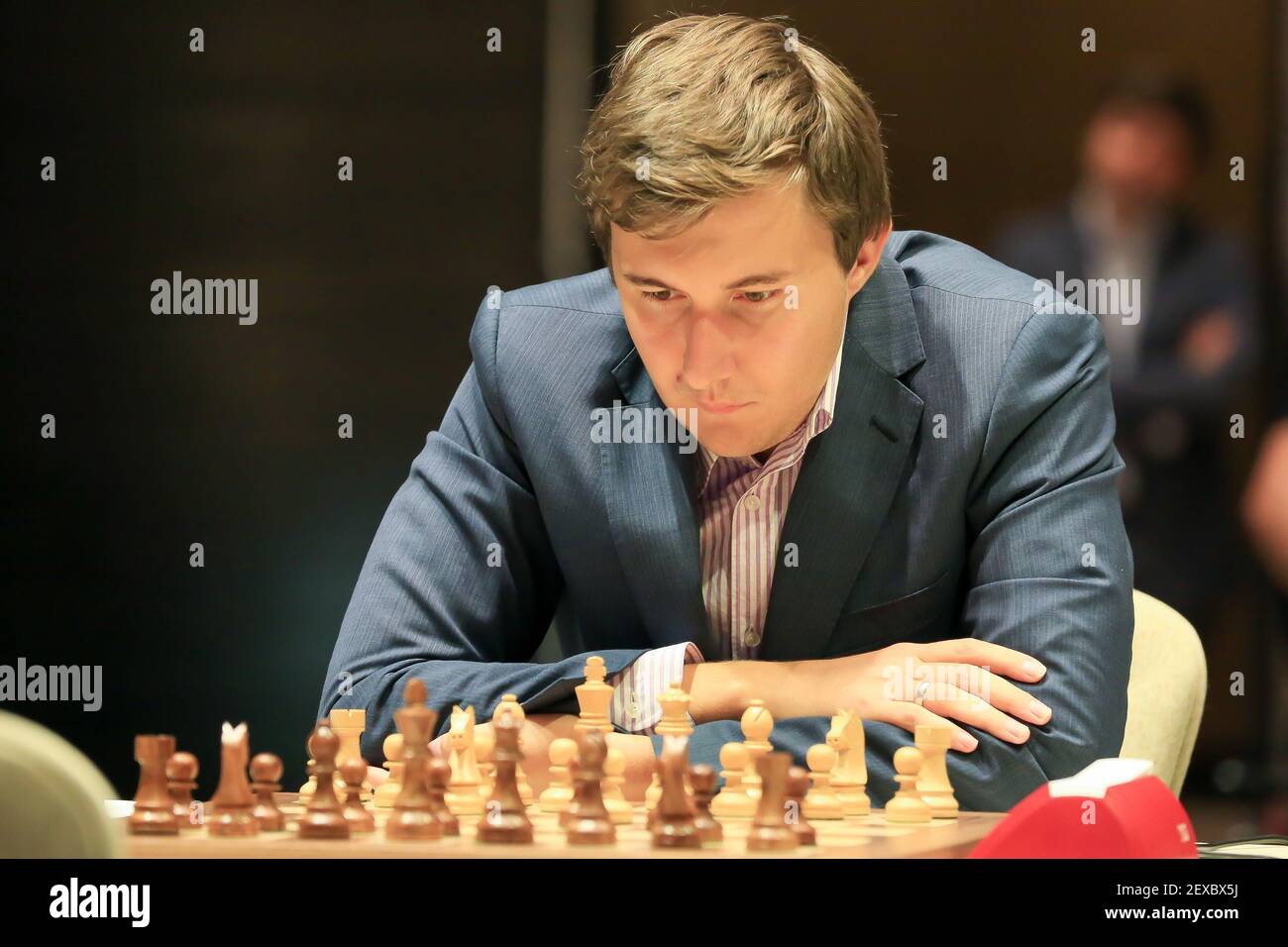 Russian Chess Grand master Sergei Karjakin concentrates during the last ...