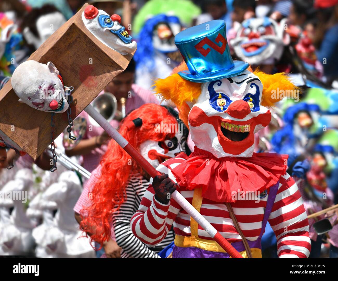 People with a disguise mask and colorful costumes participating at the ...