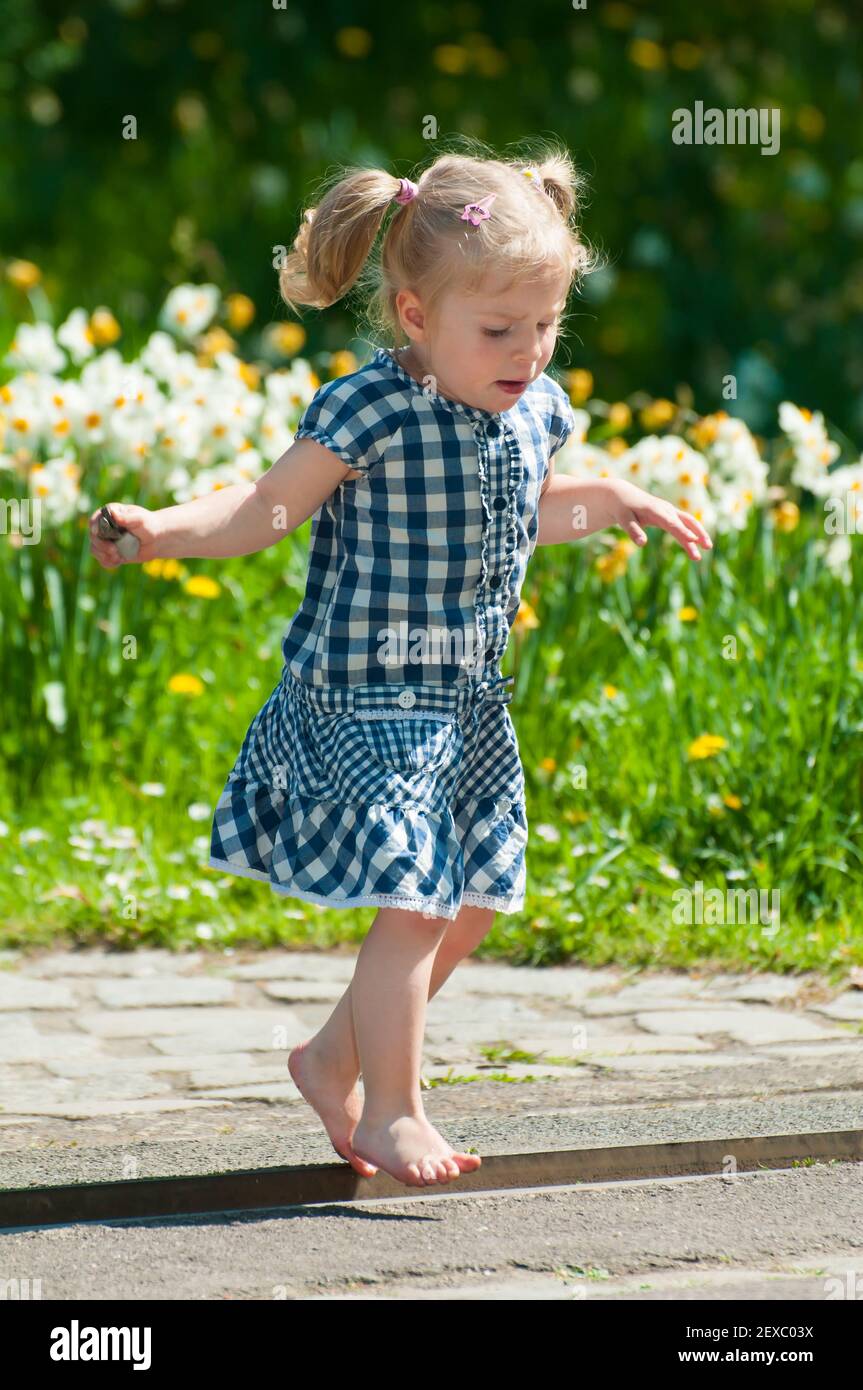 Barefoot little girl Stock Photo - Alamy